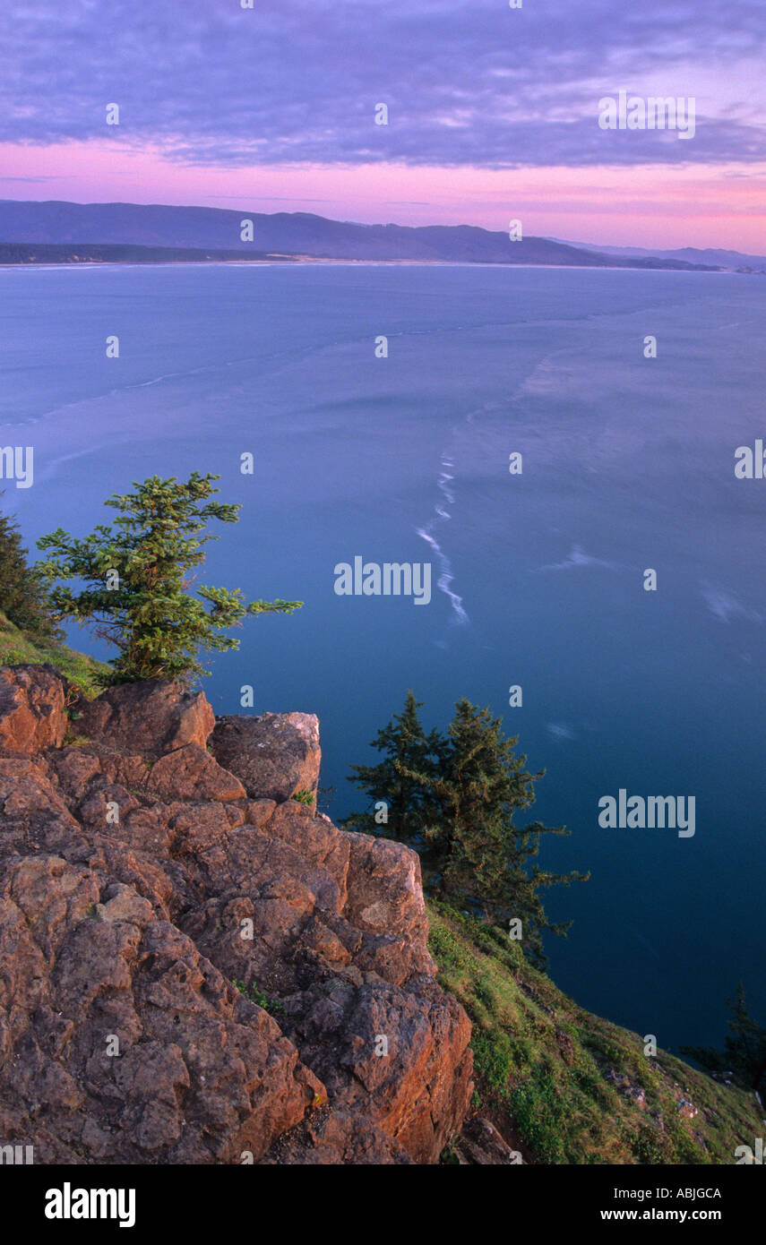 Sunset colors the rocky point of Cape Lookout State Park Oregon USA ...