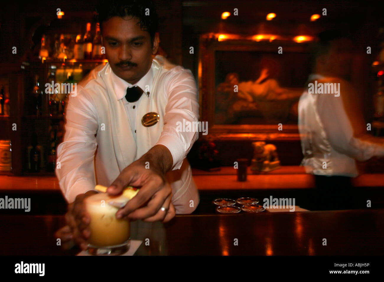 The Long Bar at the nineteenth century hotel Raffles in Singapore Stock ...