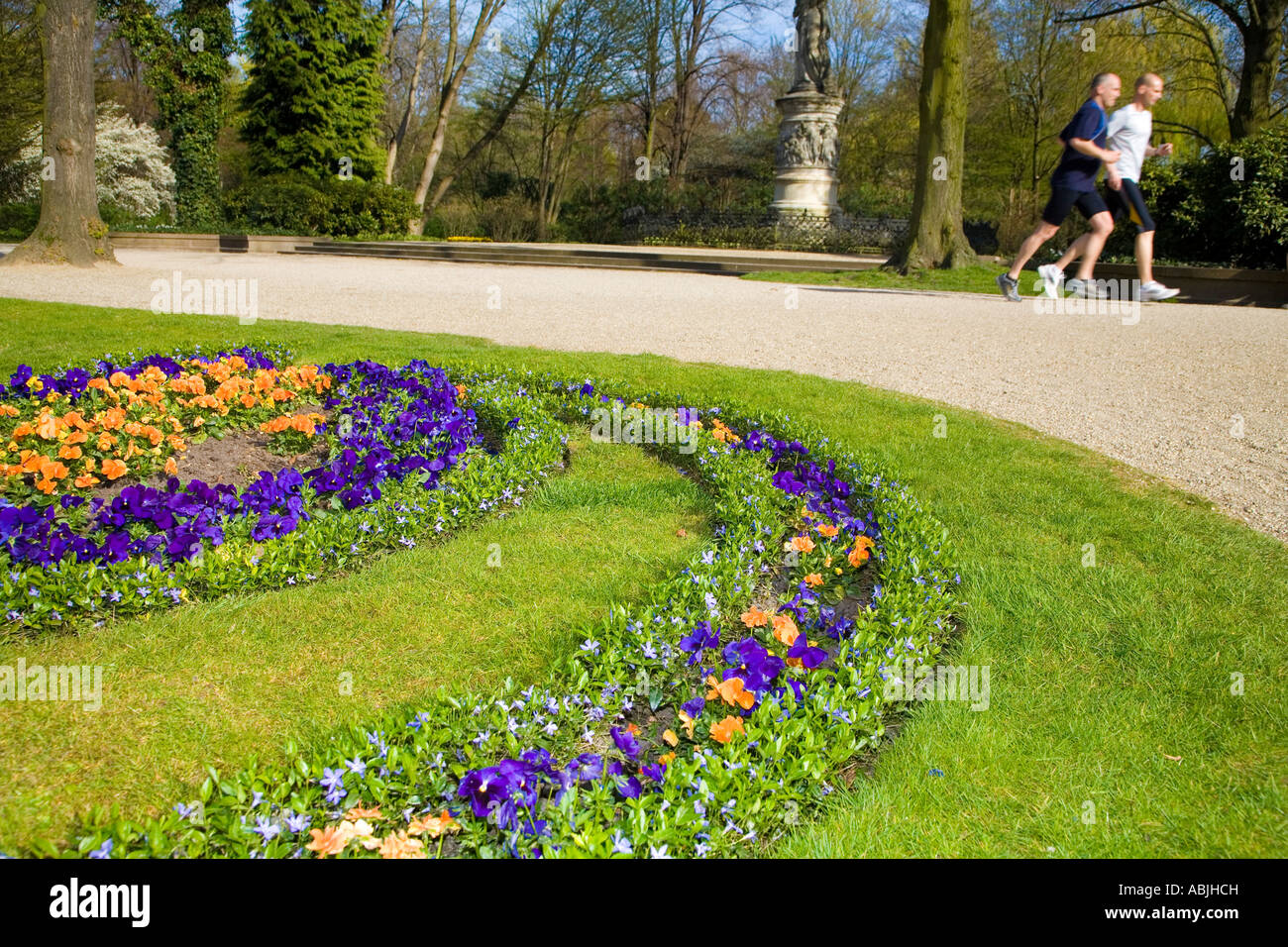 men running through park Stock Photo - Alamy