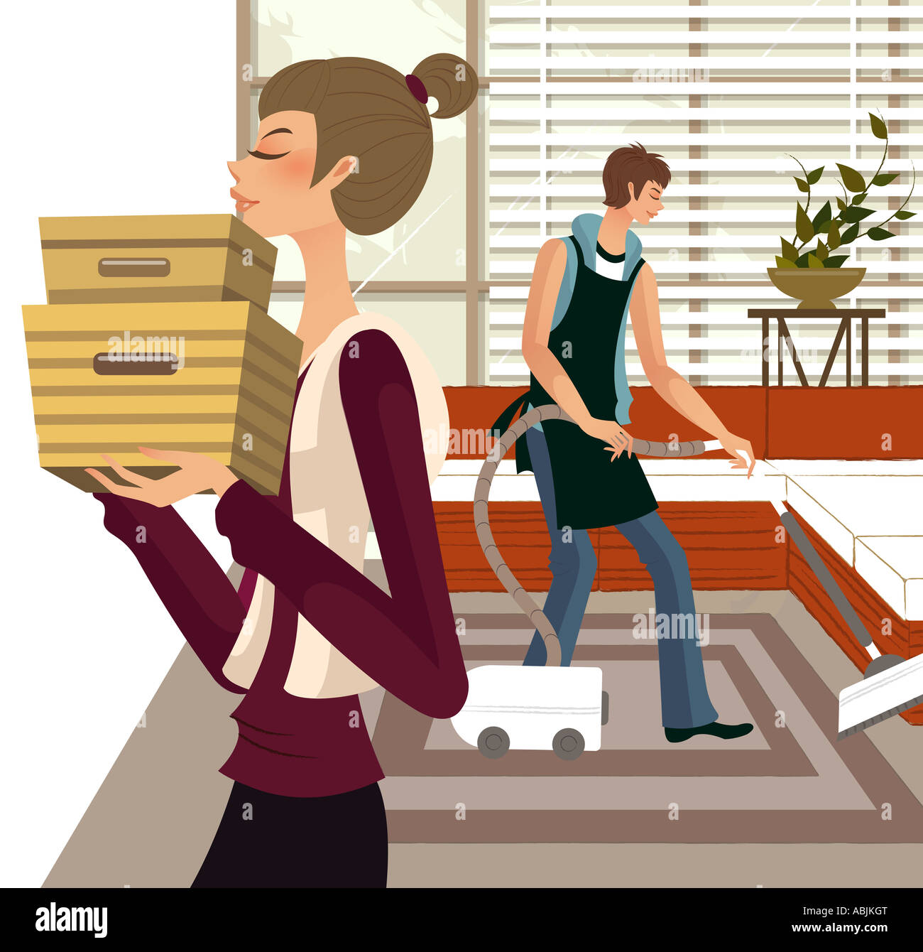 Close-up of a woman holding boxes with a man cleaning the floor with a ...