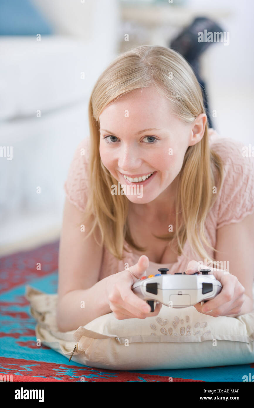 Woman playing video games Stock Photo - Alamy