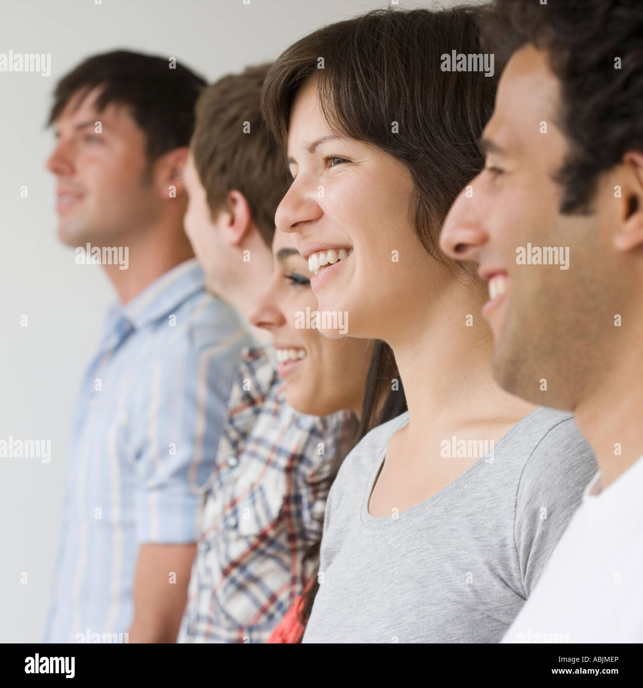 Row of people smiling Stock Photo - Alamy