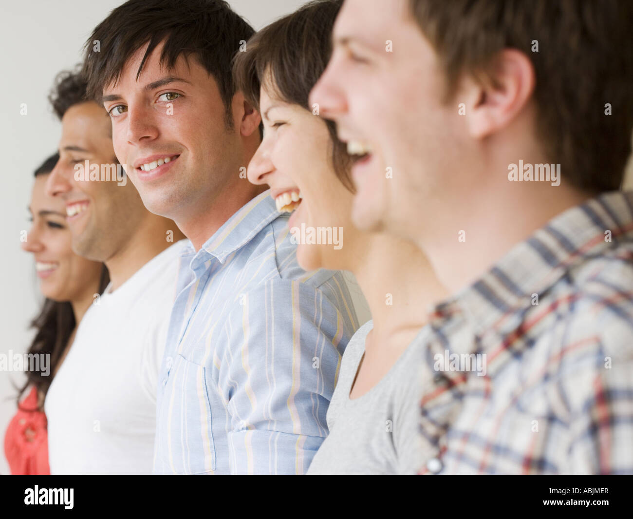 Row of people smiling Stock Photo - Alamy