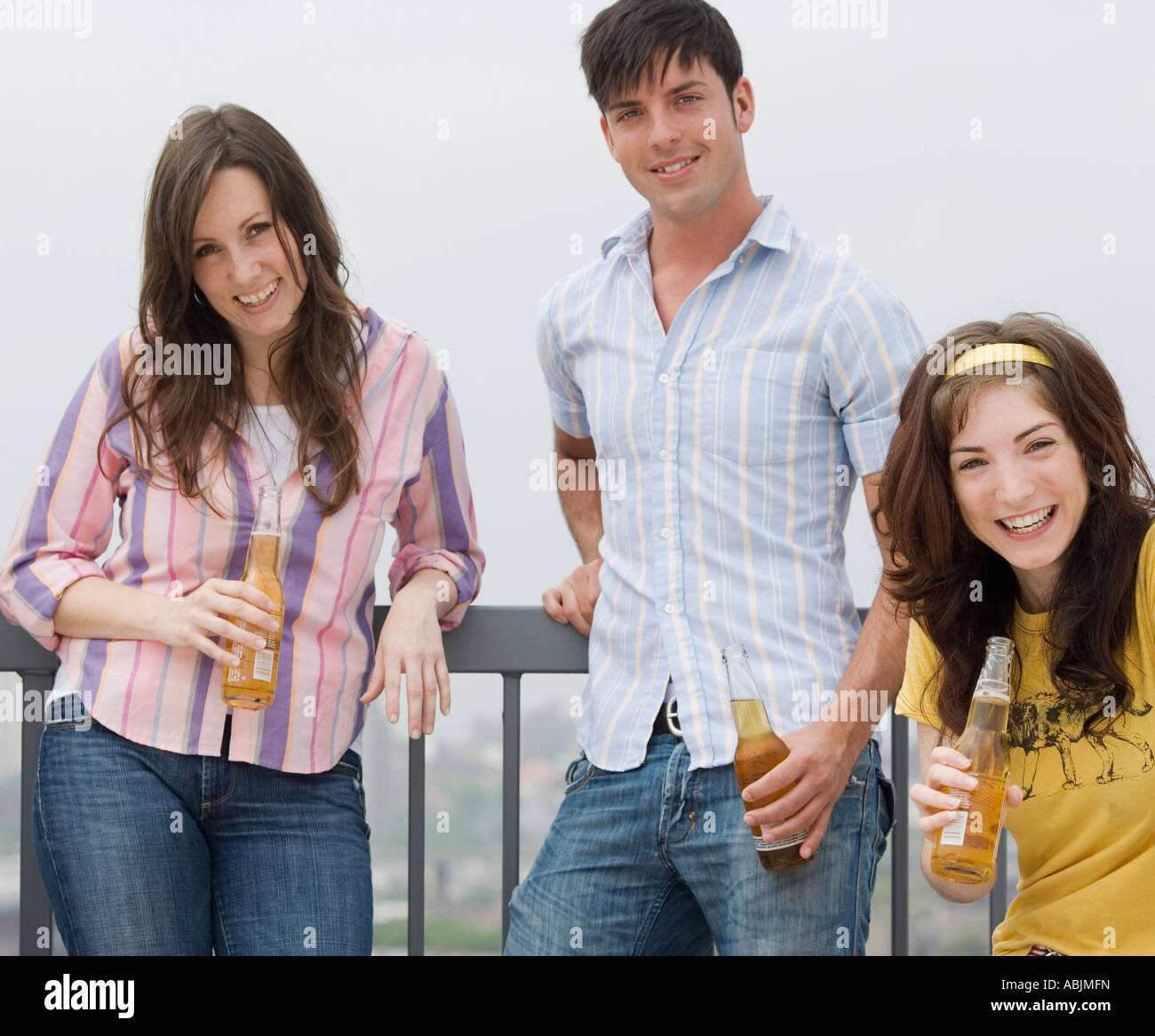 Friends drinking beer at party Stock Photo - Alamy