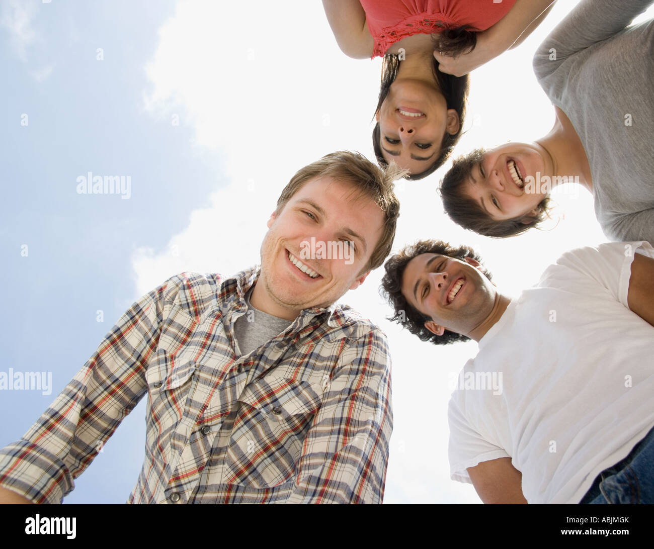 Happy friends in huddle hi-res stock photography and images - Alamy