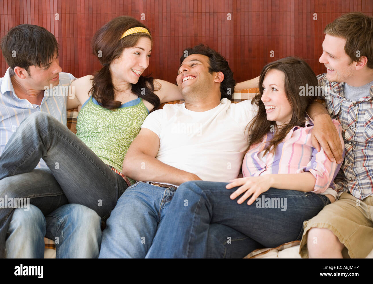 Friends on sofa Stock Photo - Alamy