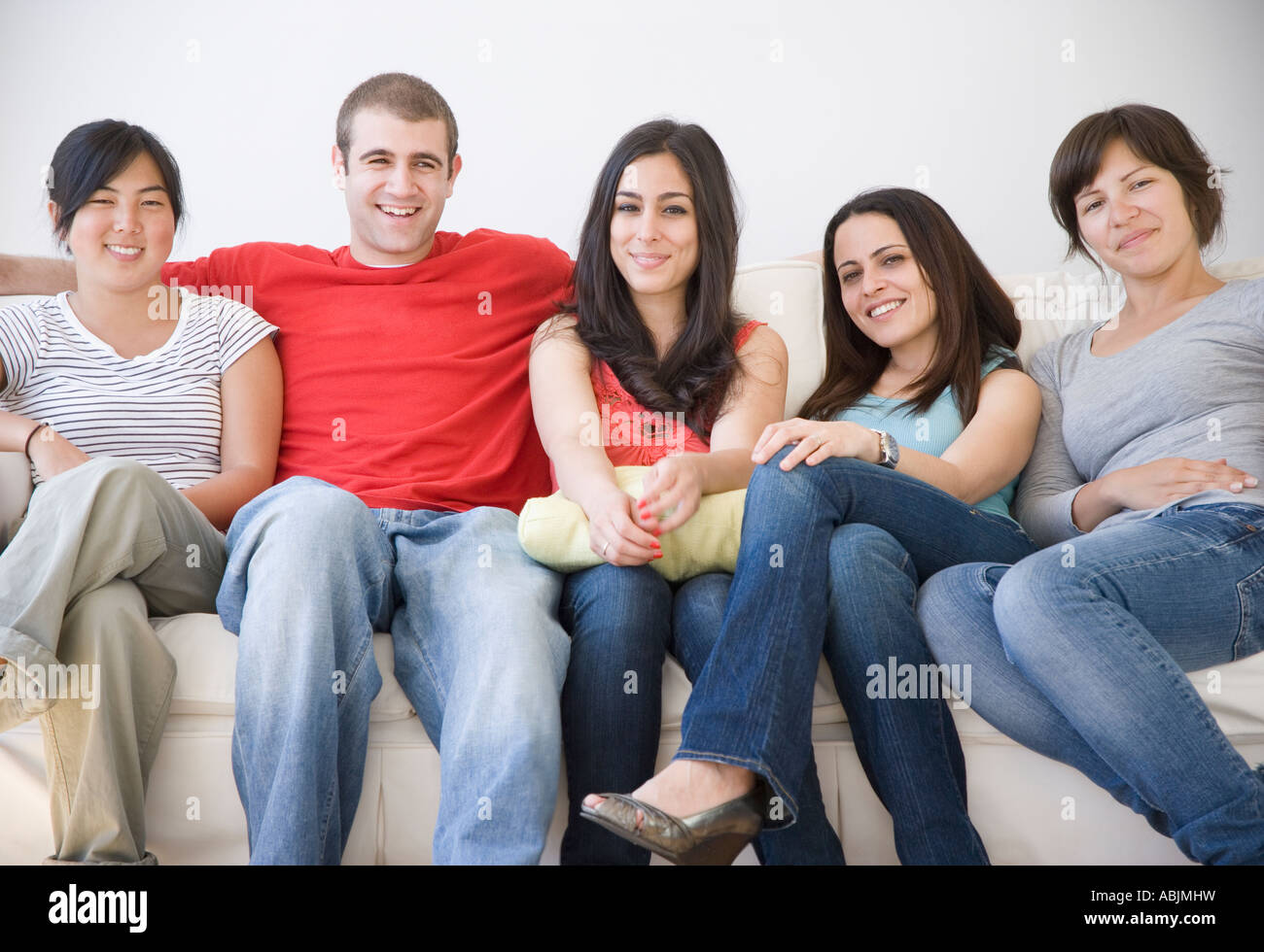 Friends on sofa Stock Photo - Alamy