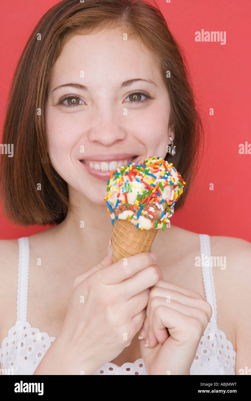 Woman eating ice cream cone Stock Photo - Alamy