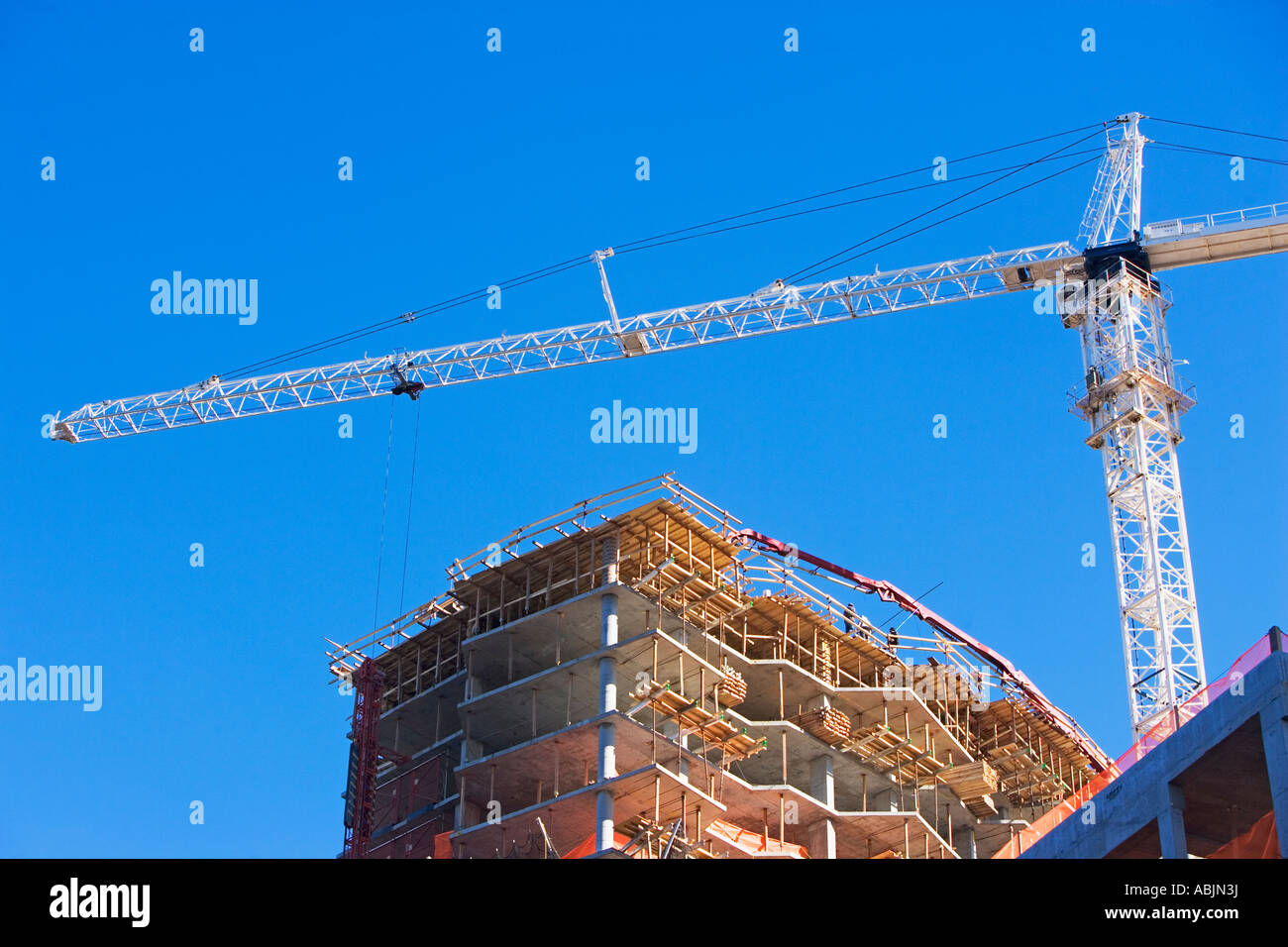 Low angle view of construction site and crane Stock Photo - Alamy