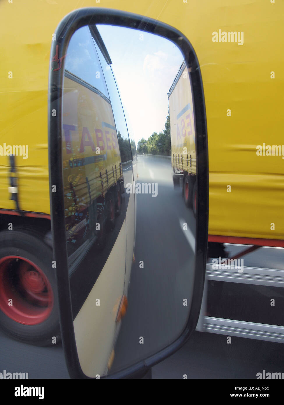 Trucks overtaking on freeway motorway Stock Photo - Alamy