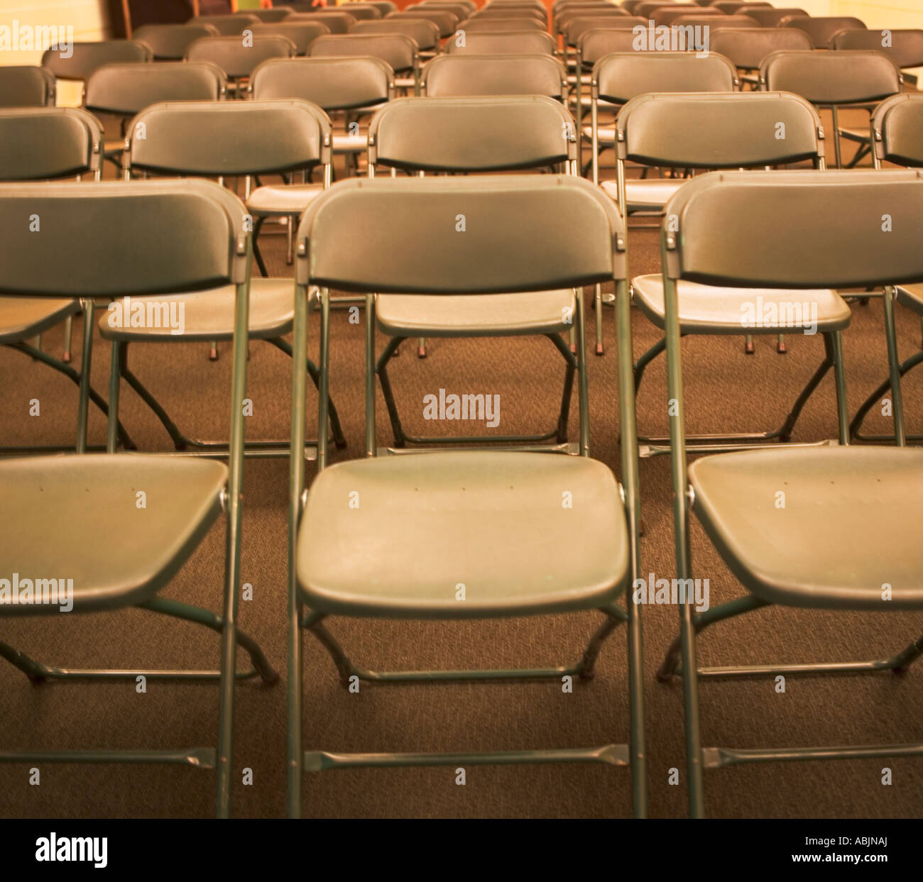 Empty folding chairs in rows Stock Photo - Alamy