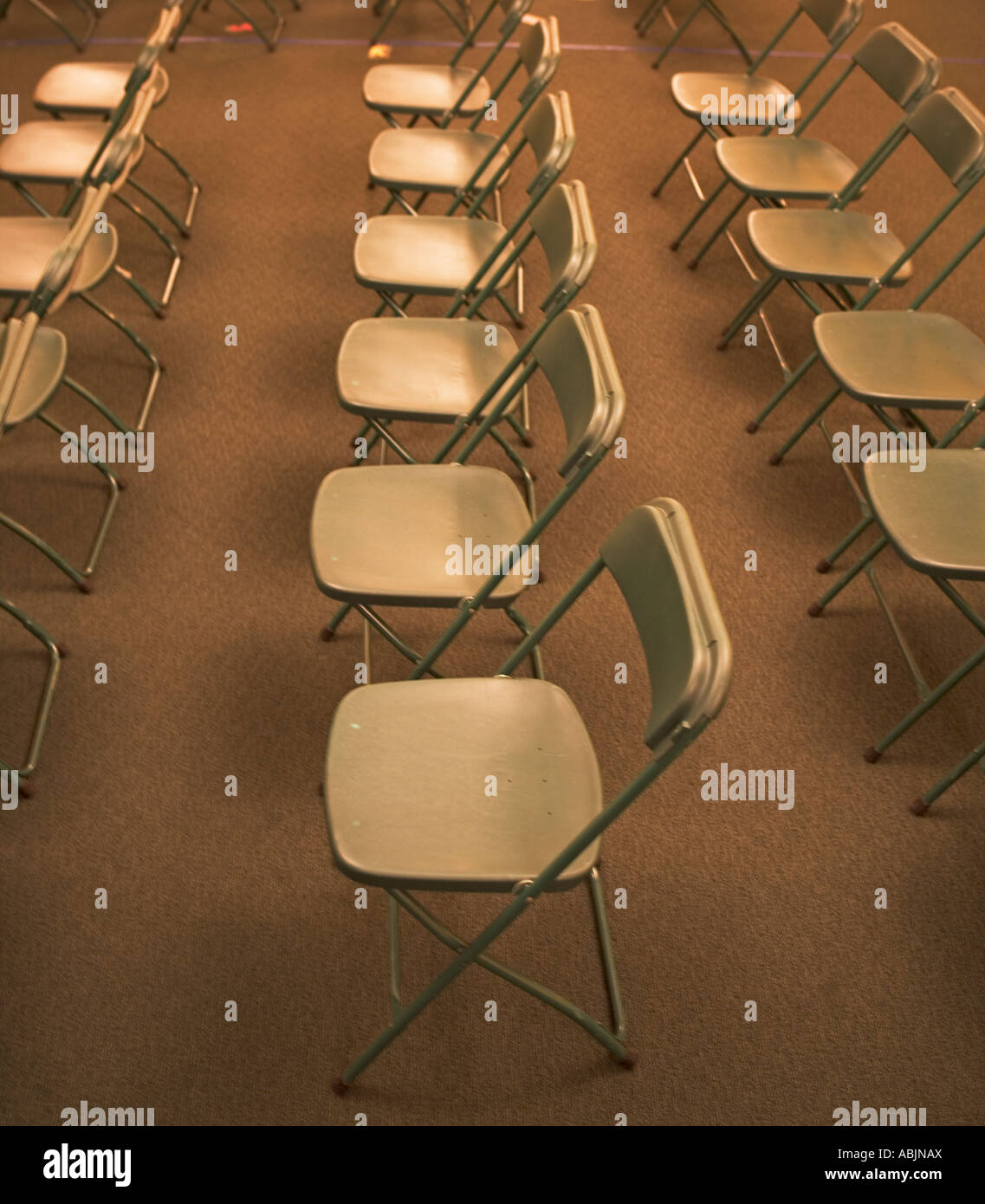 Empty folding chairs in rows Stock Photo - Alamy
