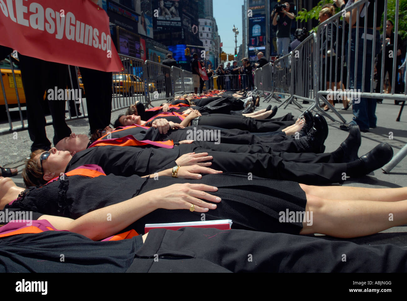 Protesters lie down in the middle of Times Square to protest the easy ...