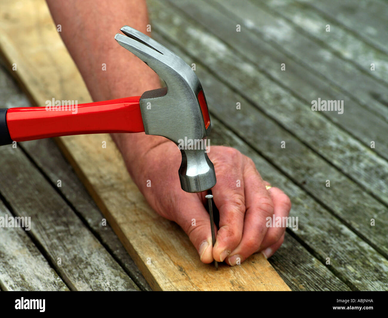 Hammer hitting nail hi-res stock photography and images - Alamy