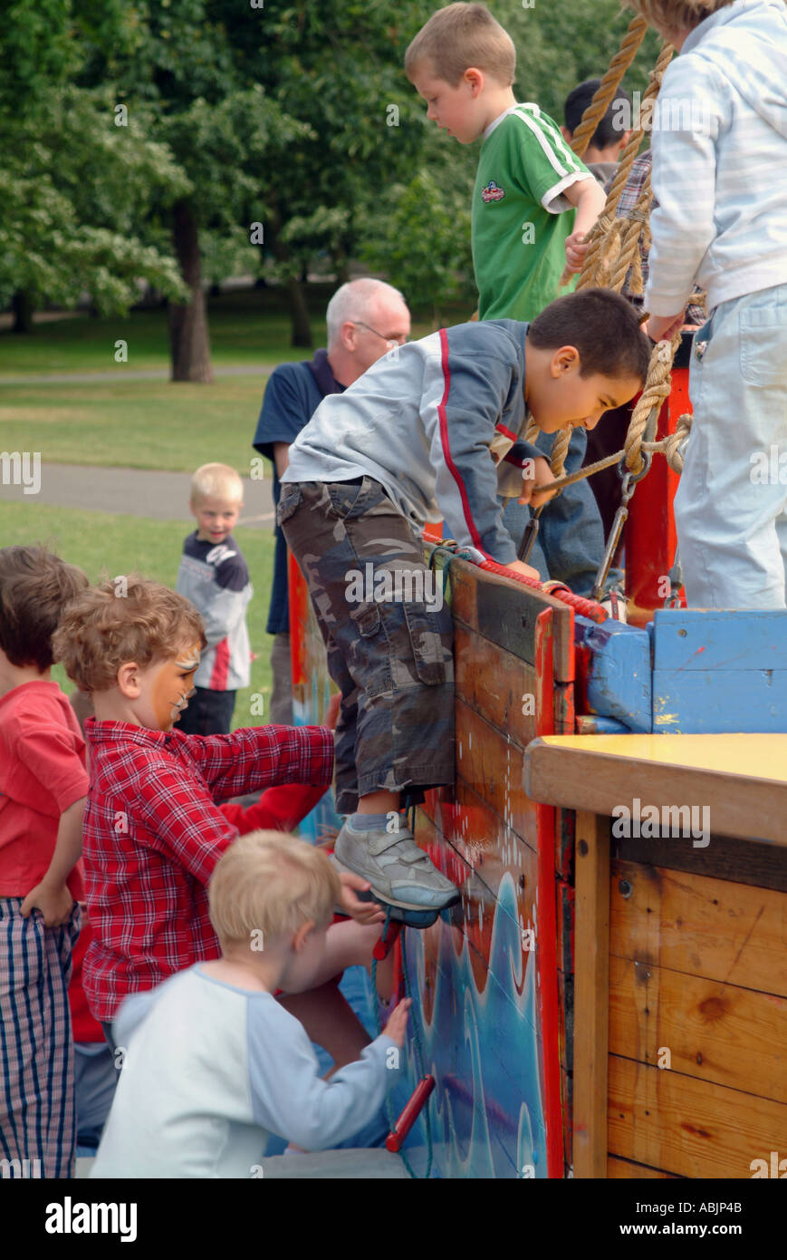 KIDS PLAYGROUND, BOY CLIMBING Stock Photo - Alamy