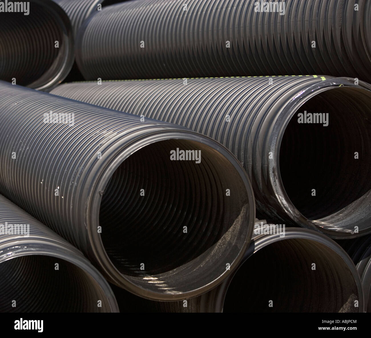 Stack of large metal pipes Stock Photo - Alamy