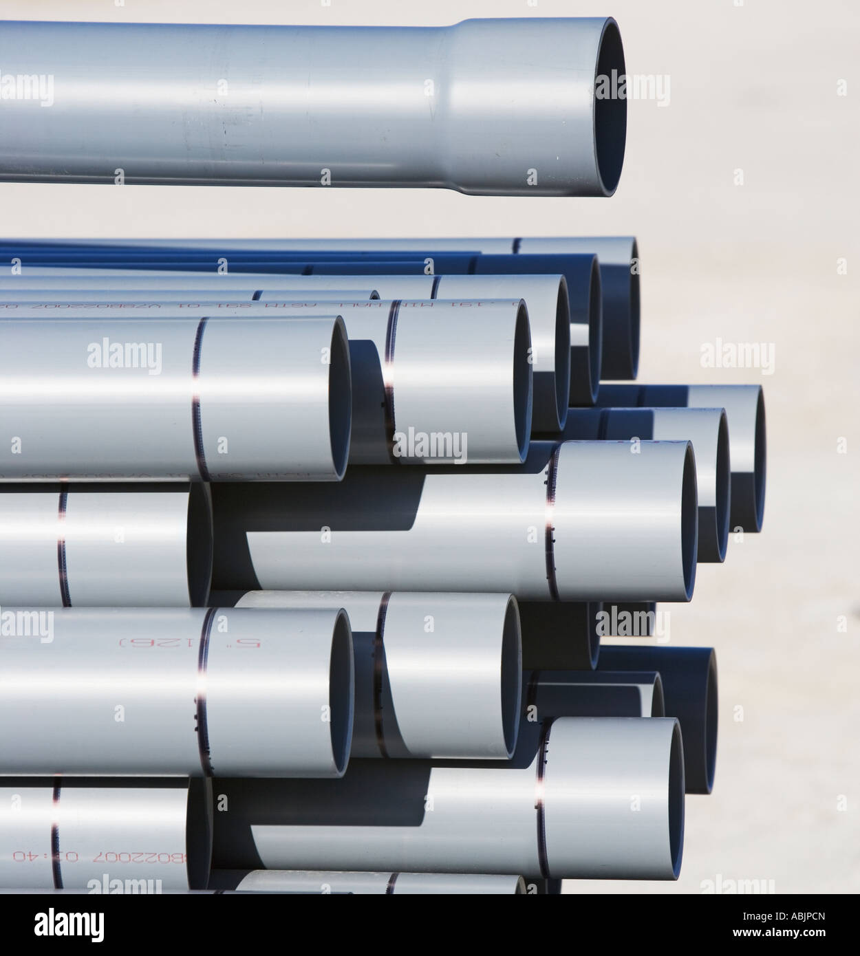 Stack of large metal pipes Stock Photo - Alamy