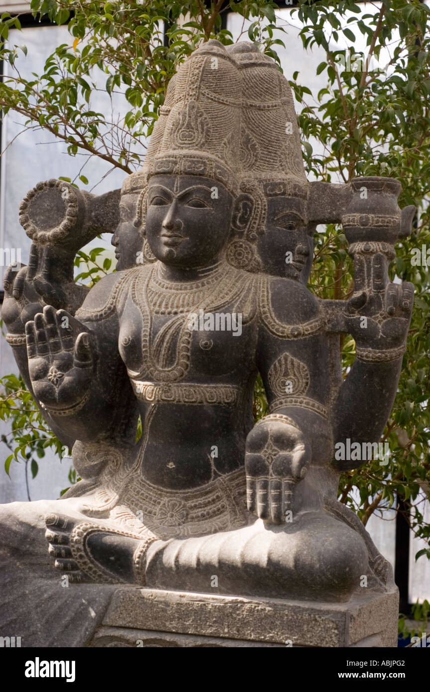 Stone statue four faced of Hindu creator god Brahma Stock Photo - Alamy