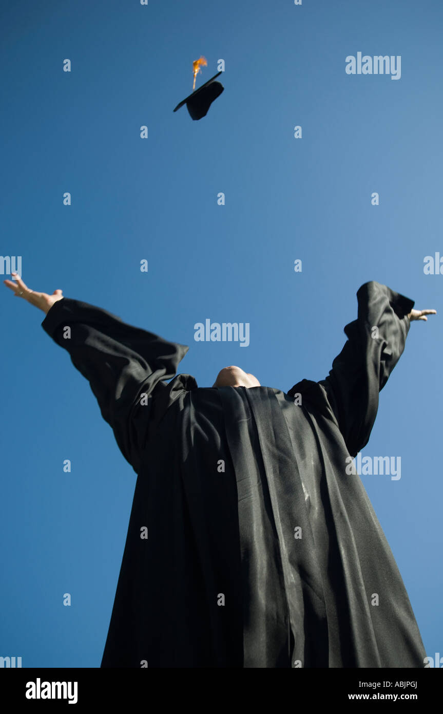 Male graduate throwing cap in air Stock Photo - Alamy