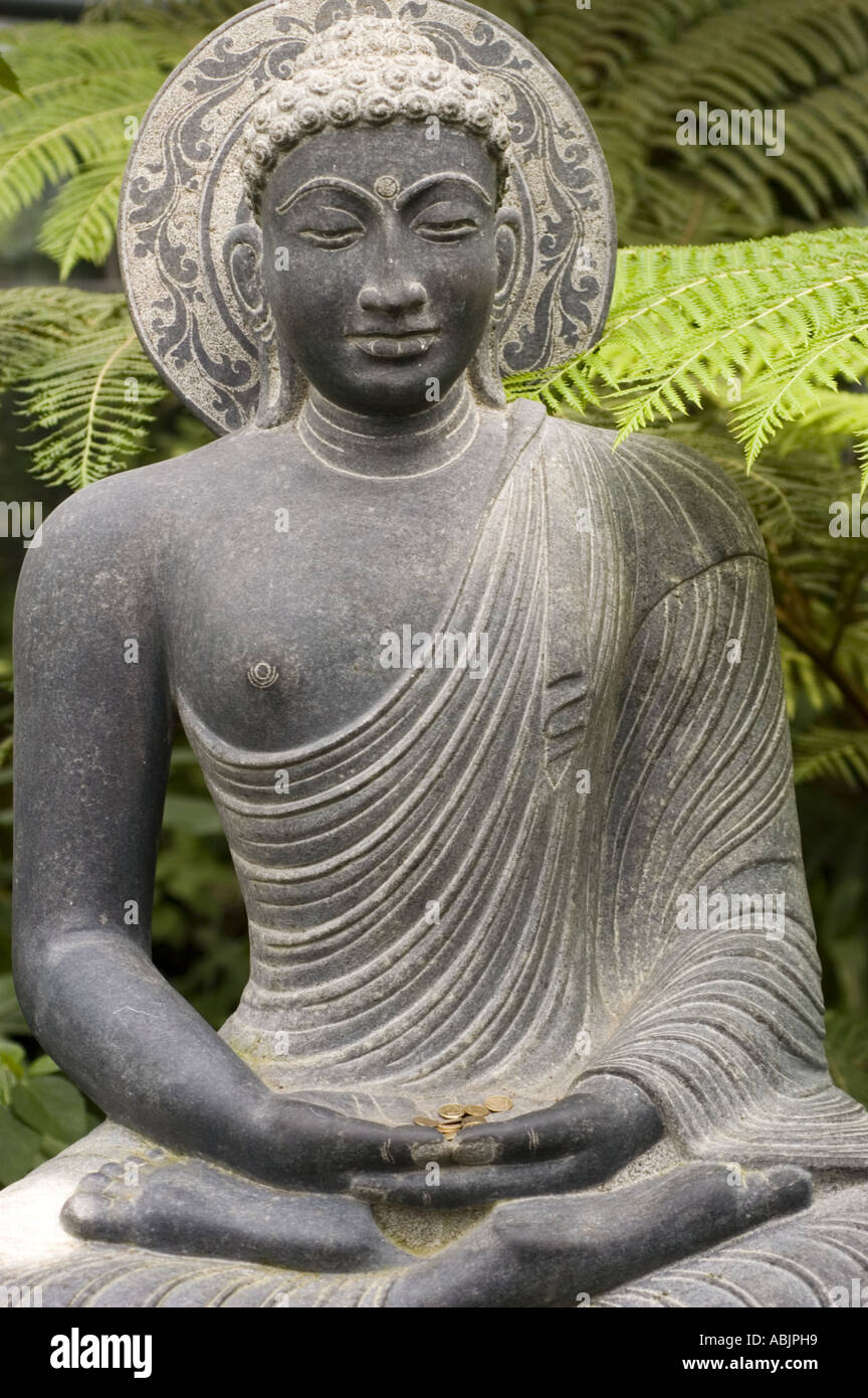 Stone statue of Lord Buddha meditating in Bodhgaya under Bodhi tree to ...