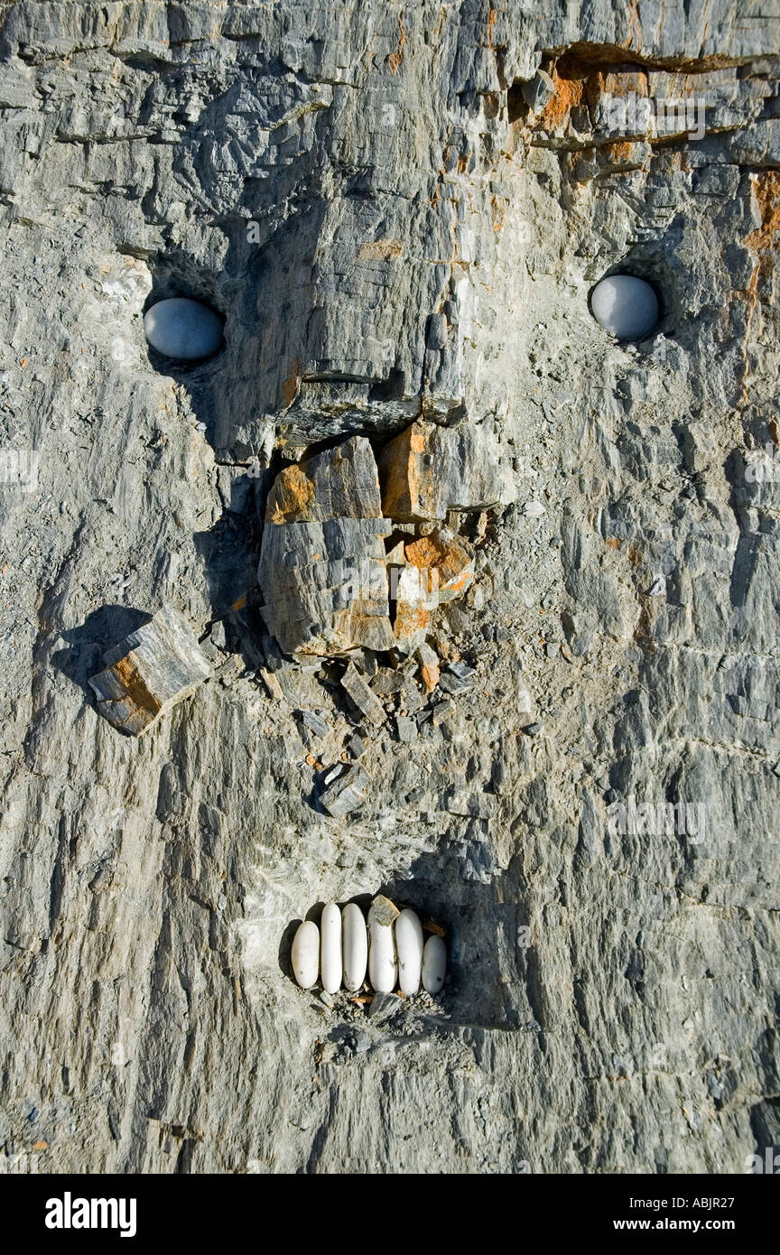 Found stone face decrepit ageing made up face Stock Photo - Alamy