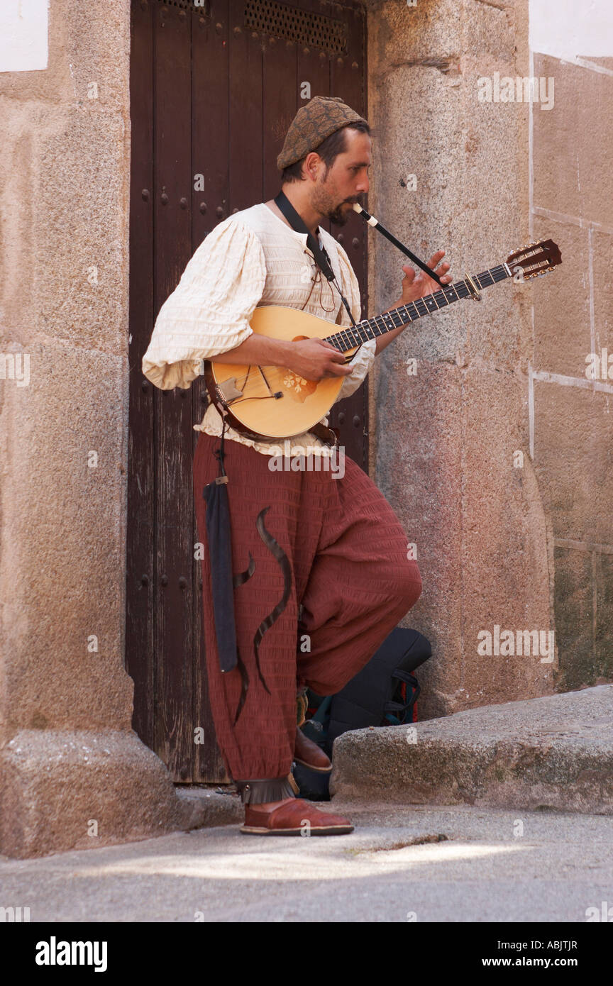 Street musician playing flute busking hi-res stock photography and ...