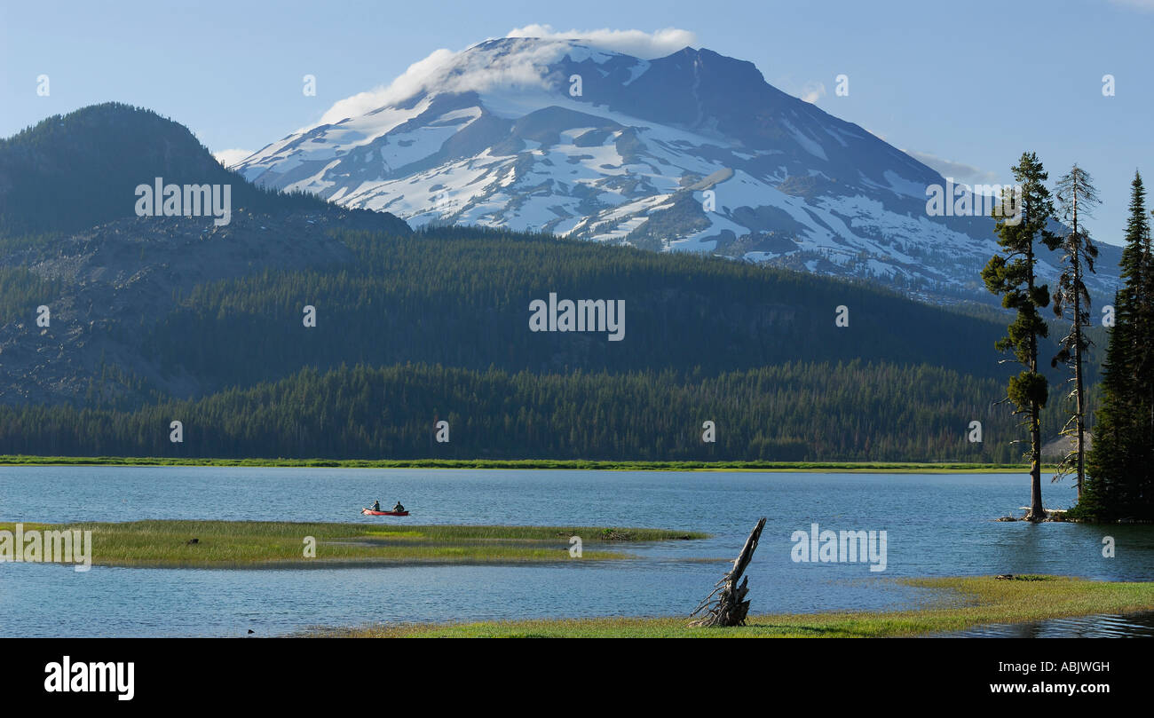 Lone canoers on Sparks Lake near Bend Oregon in Spring Deschute ...