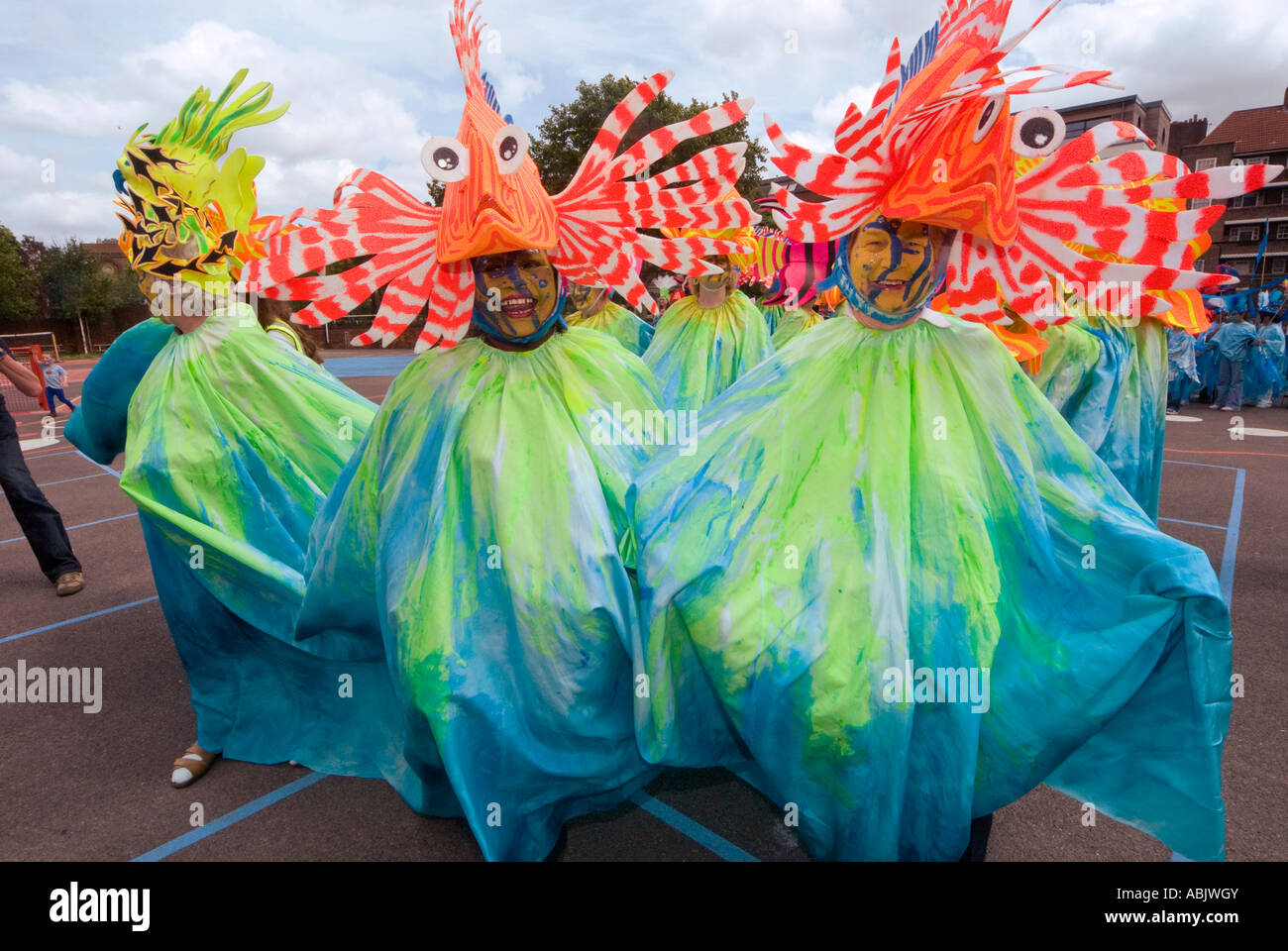 Older members of the community make a wave with sea creatures at the ...