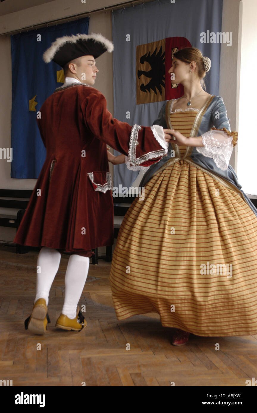 Young dancers perform a traditional old costumes dance in historical ...