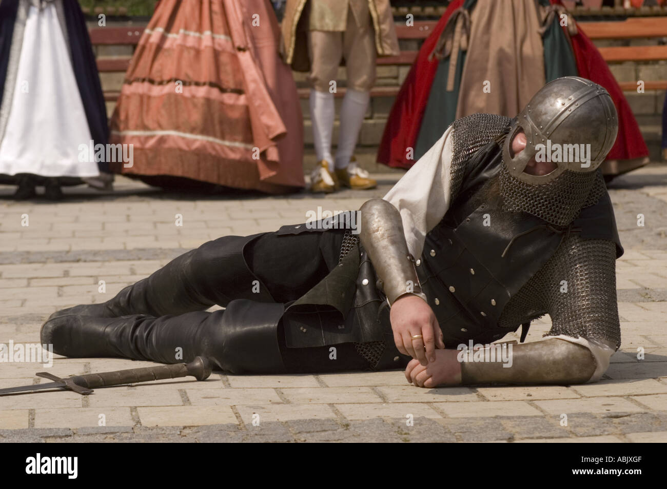 Injured knight in armour and helmet with sword in Sandomierz Poland ...