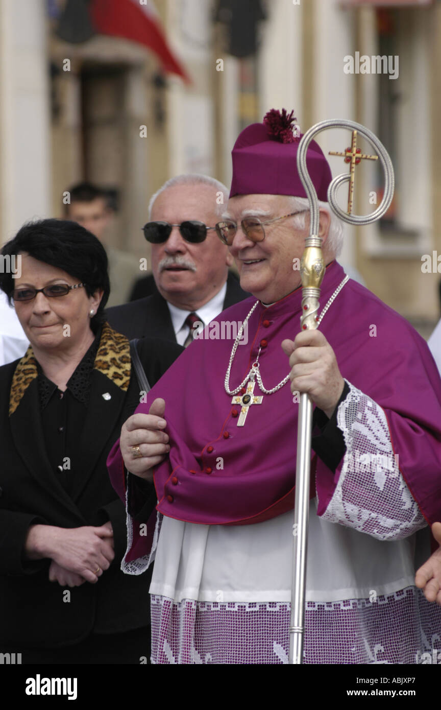 Roman Catholic bishop in purple and white dress holding a crosier ...
