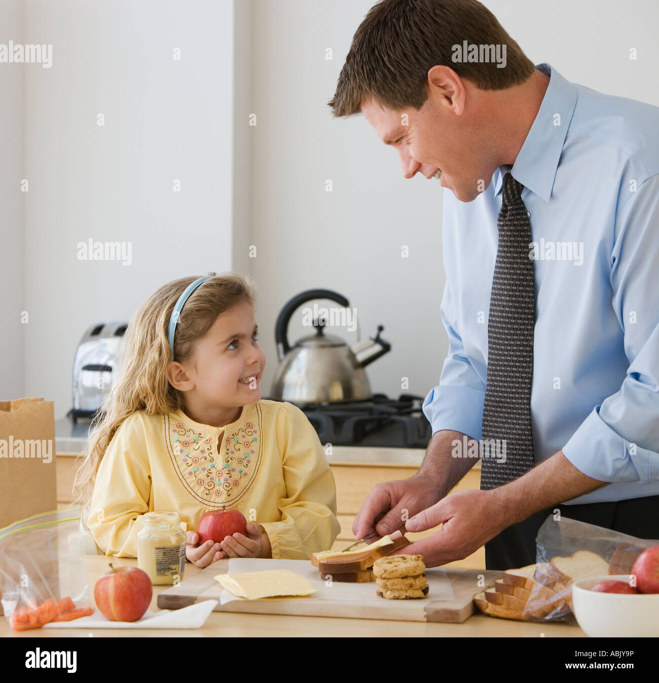 Father and daughter making breakfast Stock Photo - Alamy