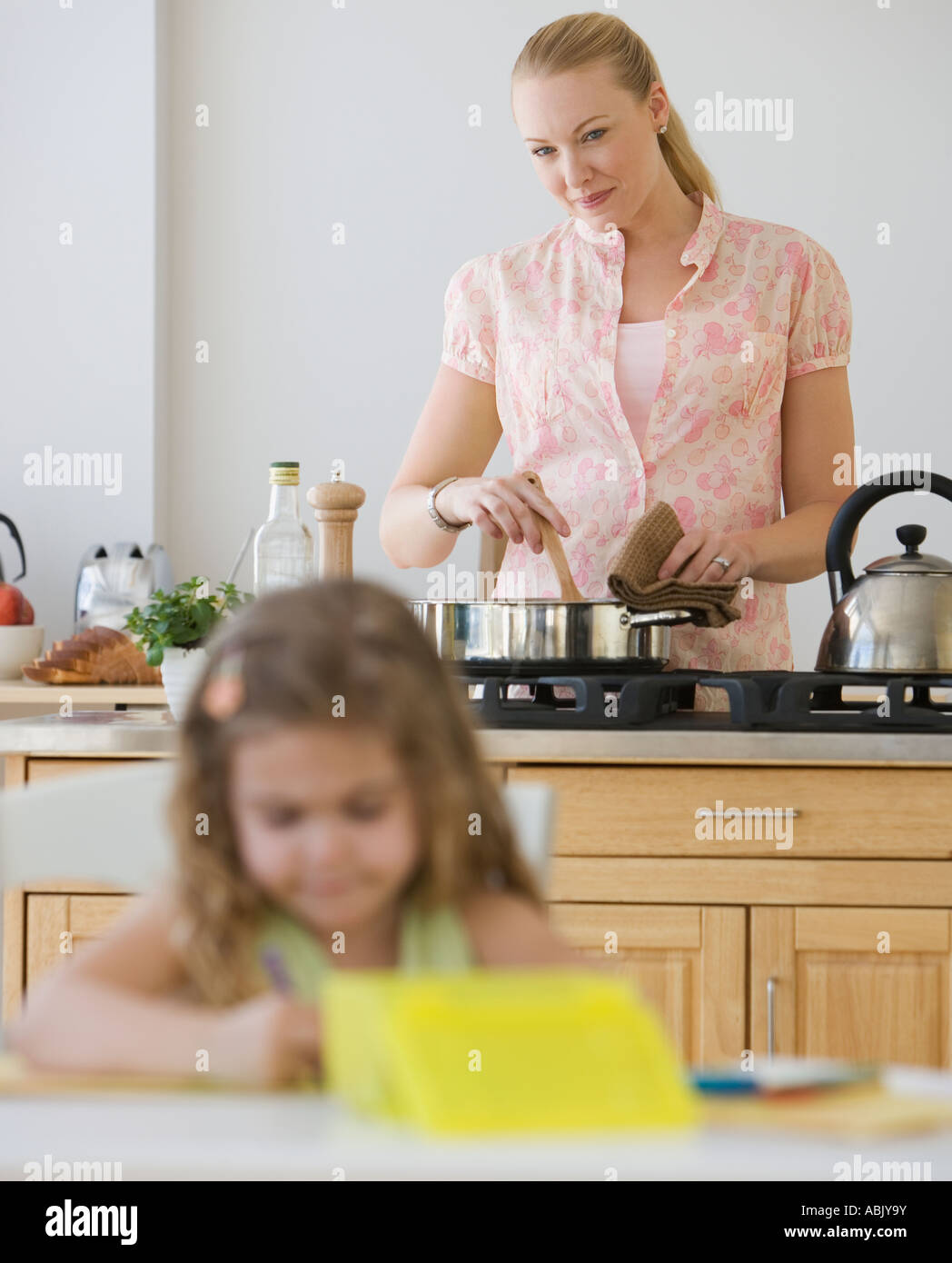 Mother watching daughter color Stock Photo - Alamy
