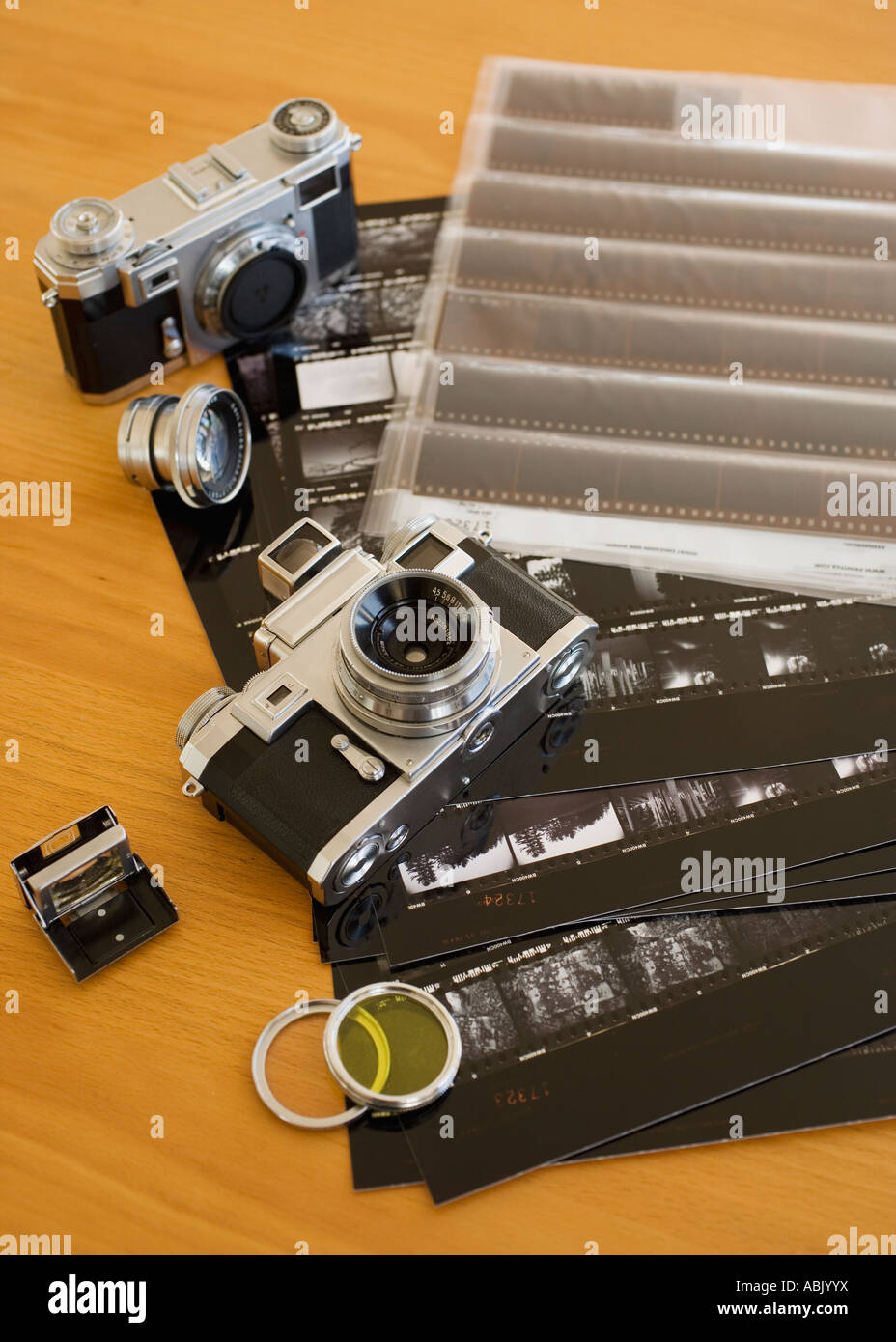 Cameras negatives and contact sheets on table Stock Photo - Alamy