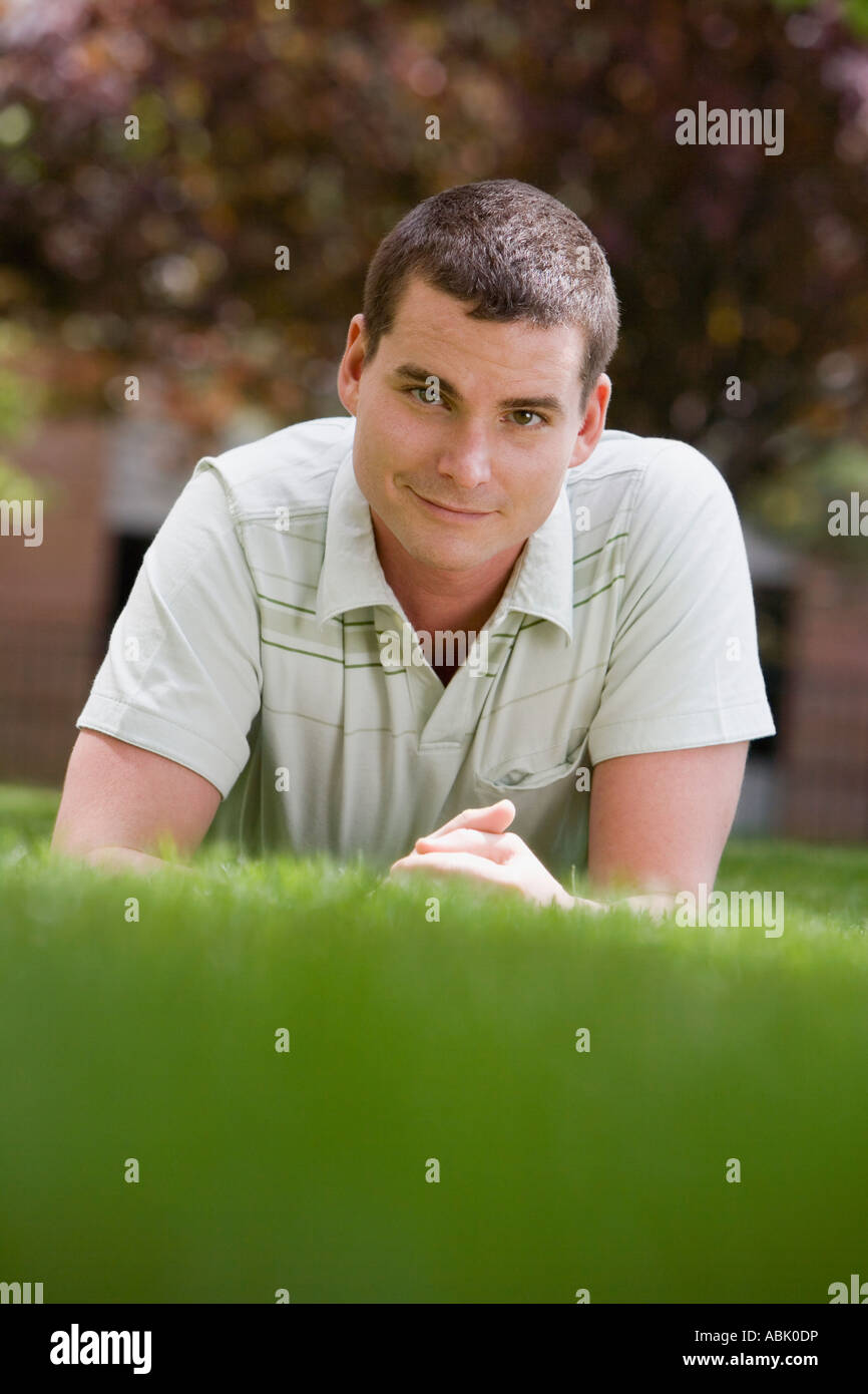 Man laying in grass Stock Photo - Alamy