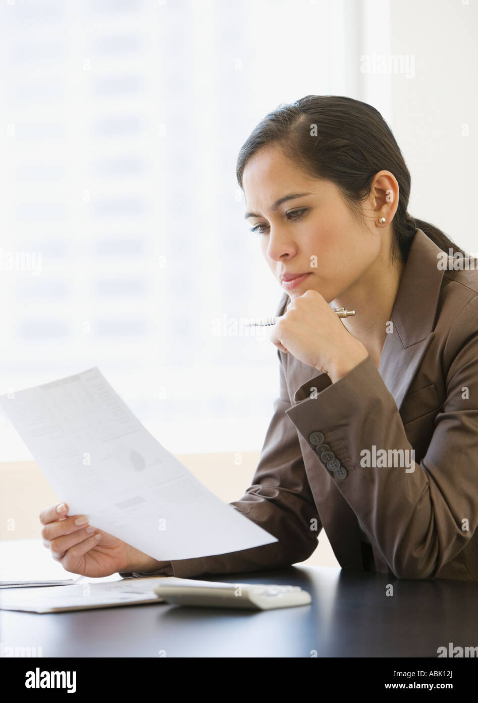 Person looking at paperwork hi-res stock photography and images - Alamy