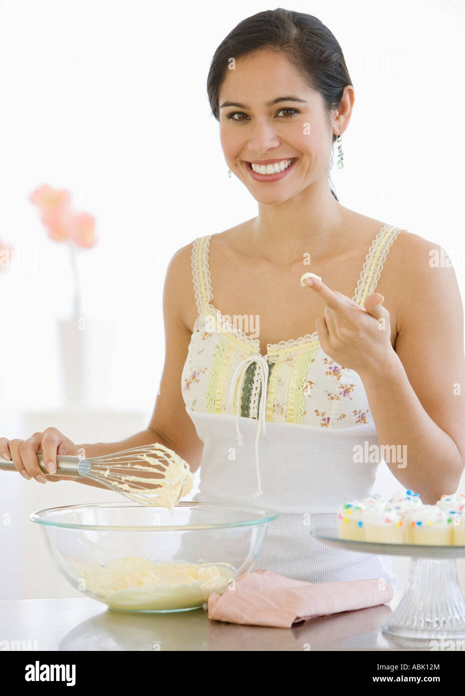 Woman stirring batter in kitchen Stock Photo - Alamy