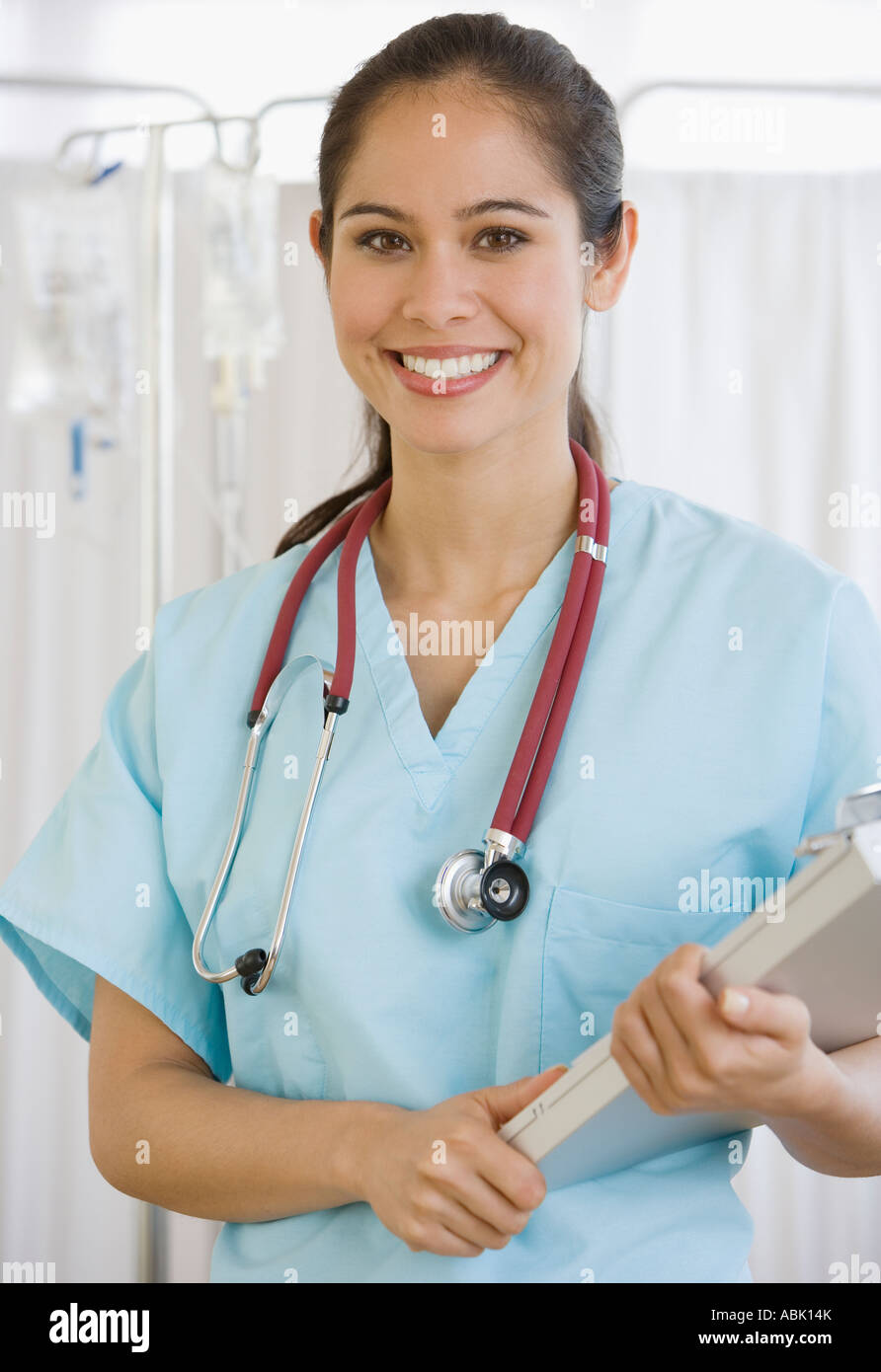 Female doctor holding chart Stock Photo - Alamy