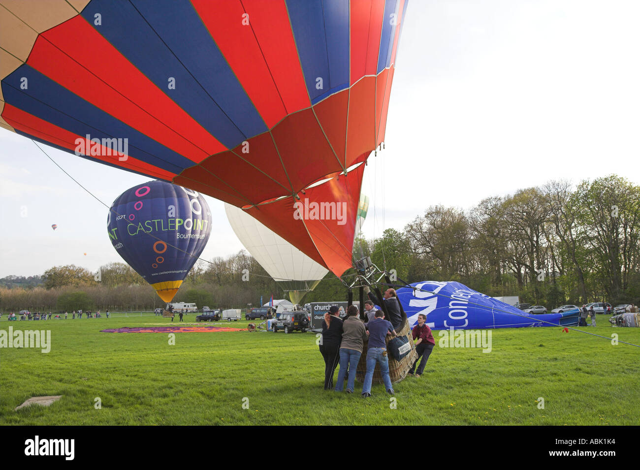 Wind inclines balloon while crew struggle Stock Photo - Alamy