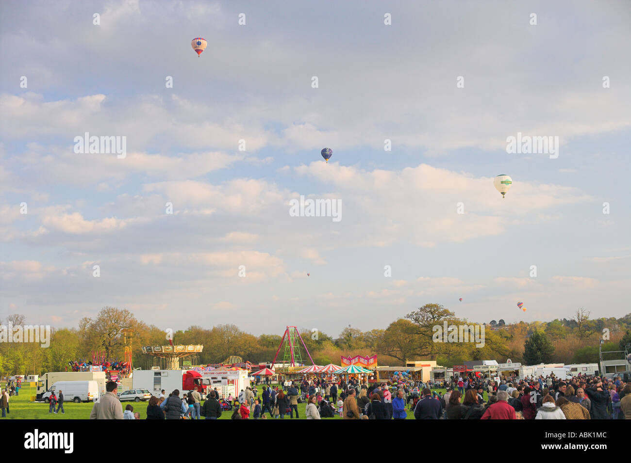Balloon event and funfair with several balloons floating skywards Stock ...