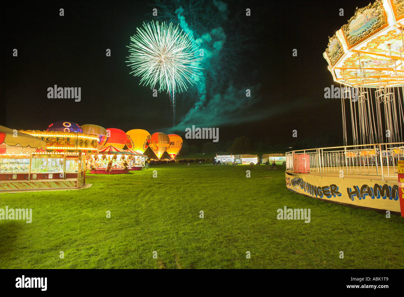 Fireworks and funfair at balloon spectacular Surrey Stock Photo - Alamy