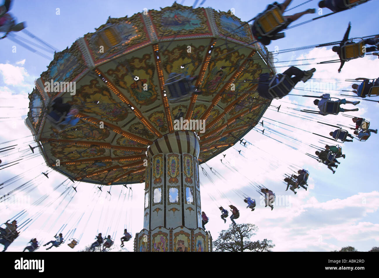 Tilting carousel at speed and loaded Stock Photo - Alamy