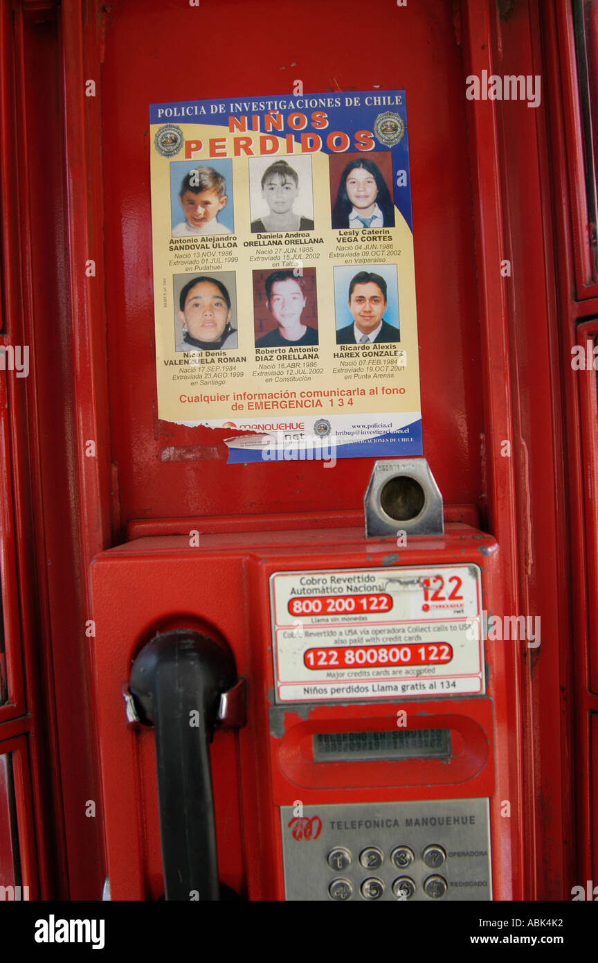 Telephone stand in Santiago de Chile with advertisements of lost people ...