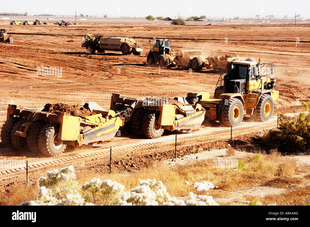 earthmoving equipment at work preparing a construction site for ...