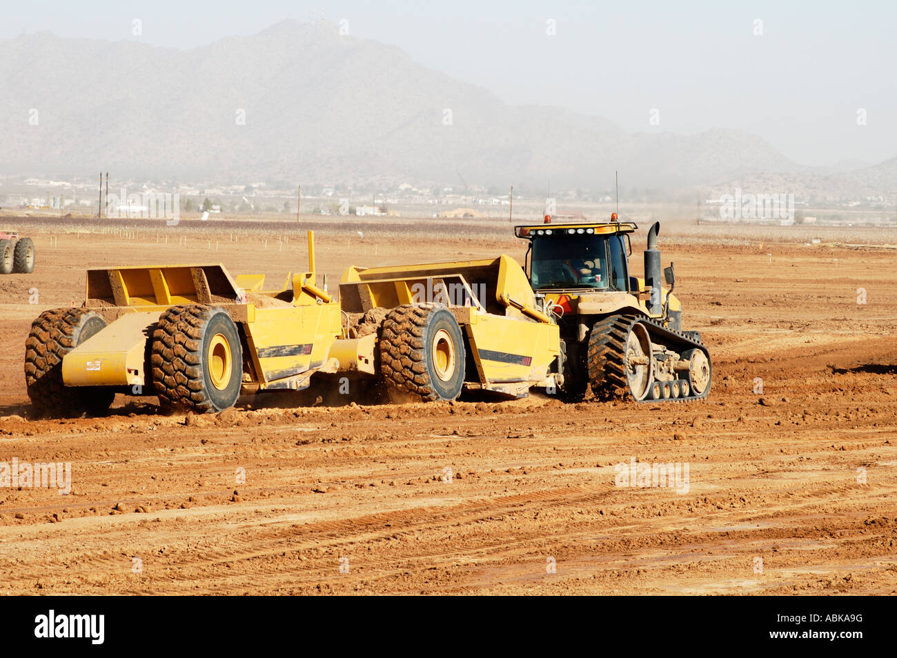 earthmoving equipment at work preparing a construction site for ...