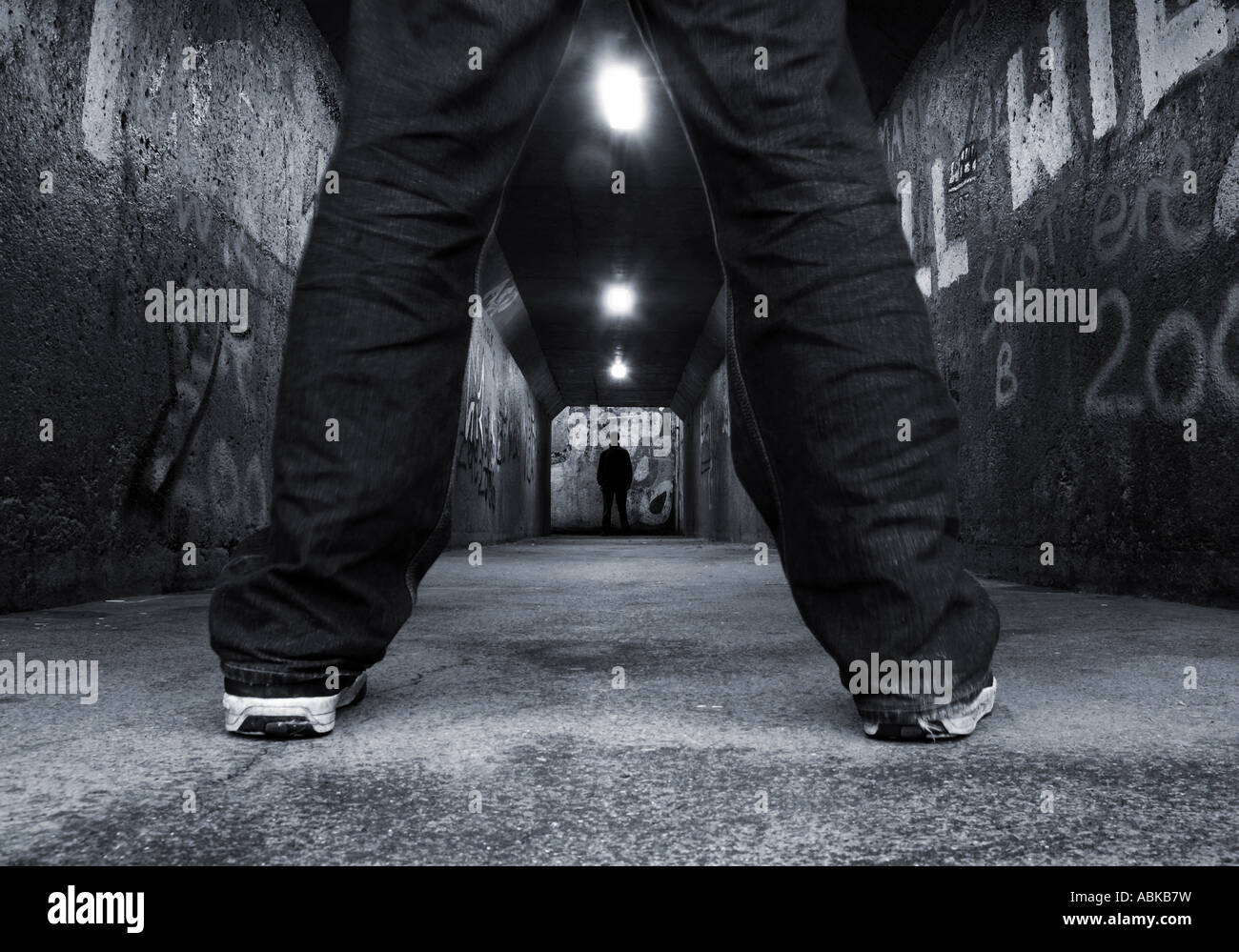 Two men facing off in a subway Stock Photo - Alamy