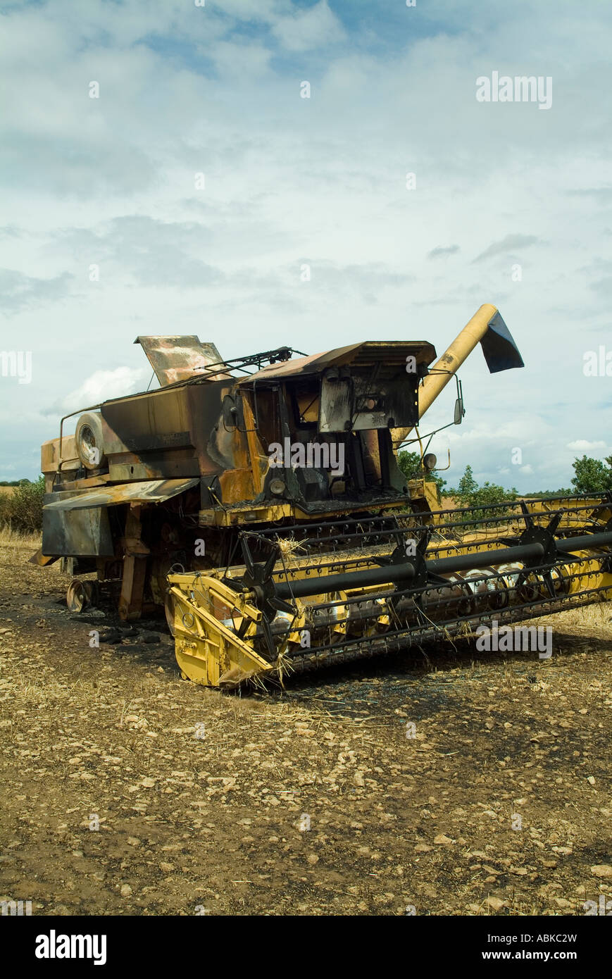 new holland combine harvester destroyed by fire Stock Photo - Alamy