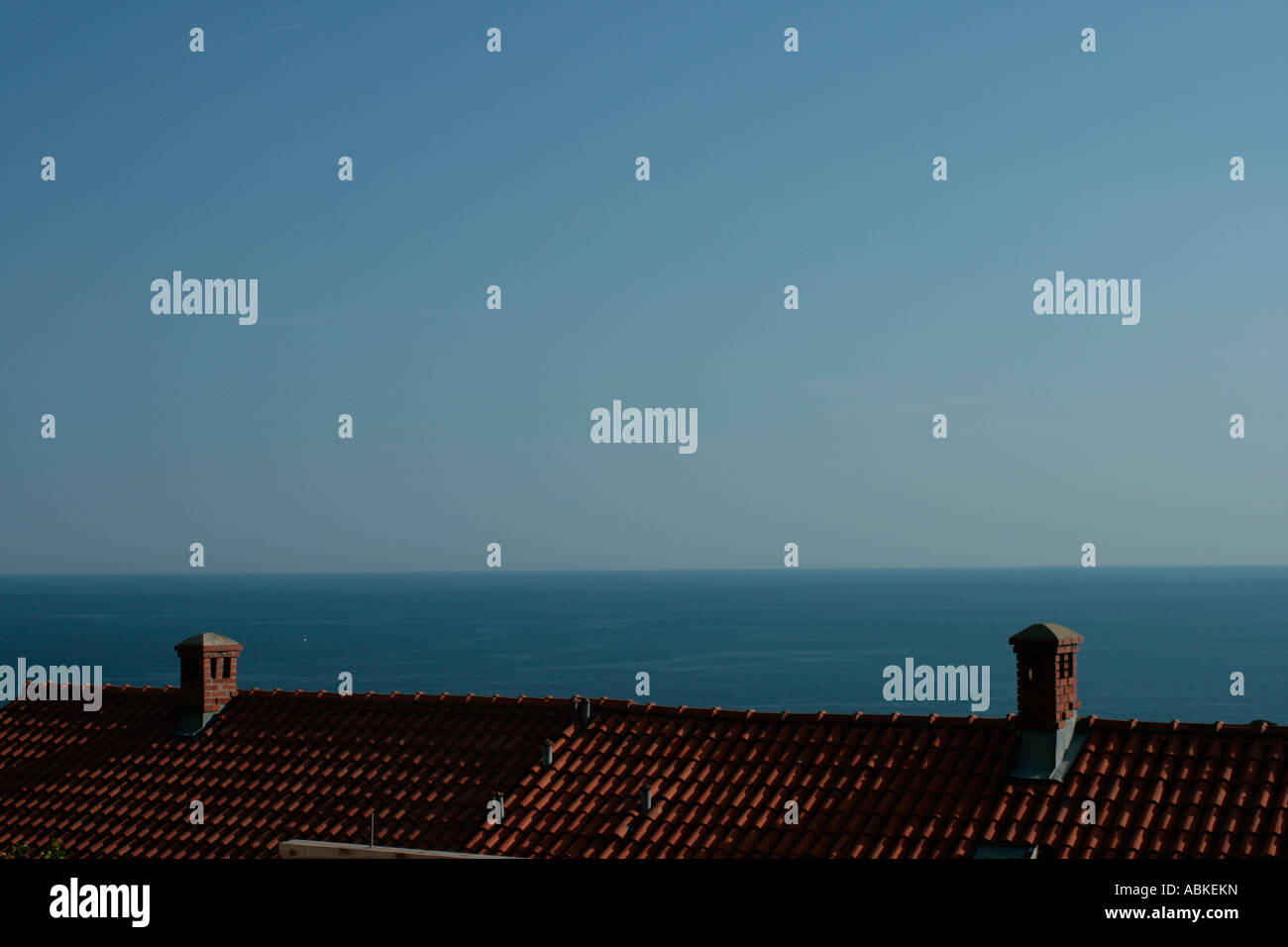 Ocean horizon scene over roof top Stock Photo - Alamy
