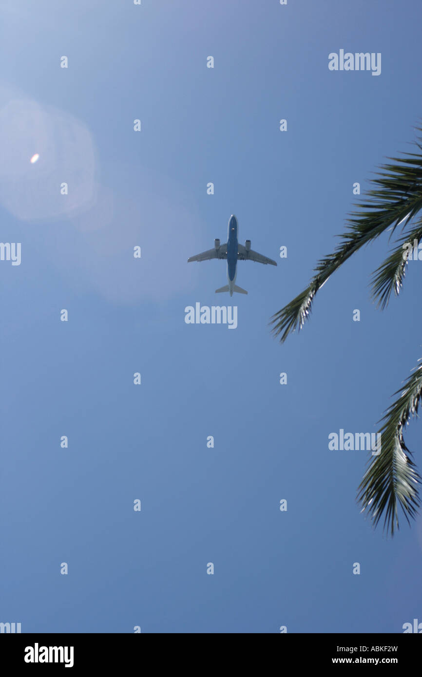 Underneath view of plane in flight Stock Photo - Alamy