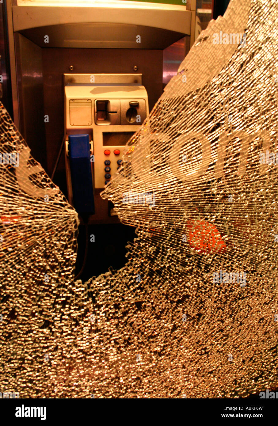 Smashed glass in telephone box Stock Photo - Alamy